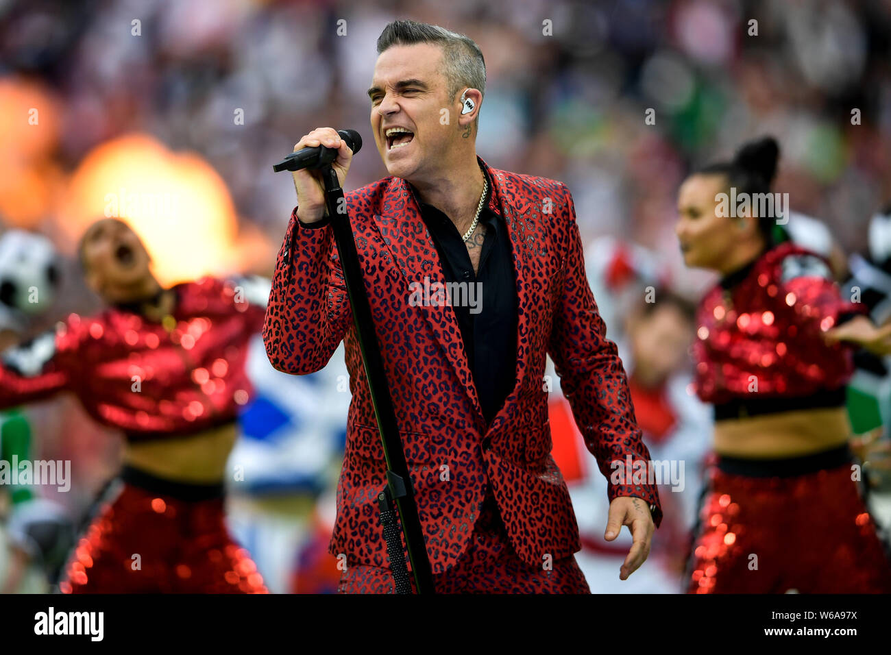 English singer Robbie Williams performs during the opening ceremony of ...