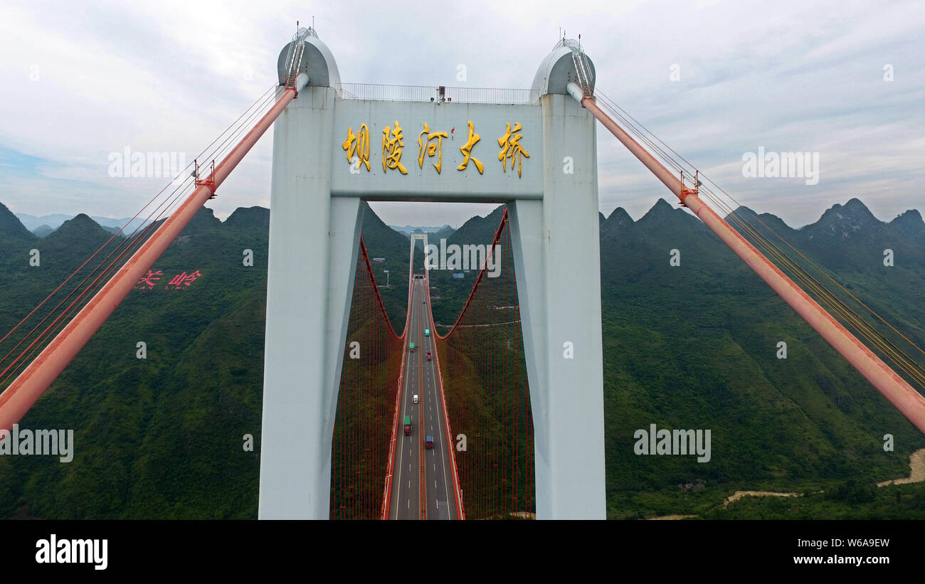 Aerial view of the Baling River Bridge 370 meters high over a valley in ...