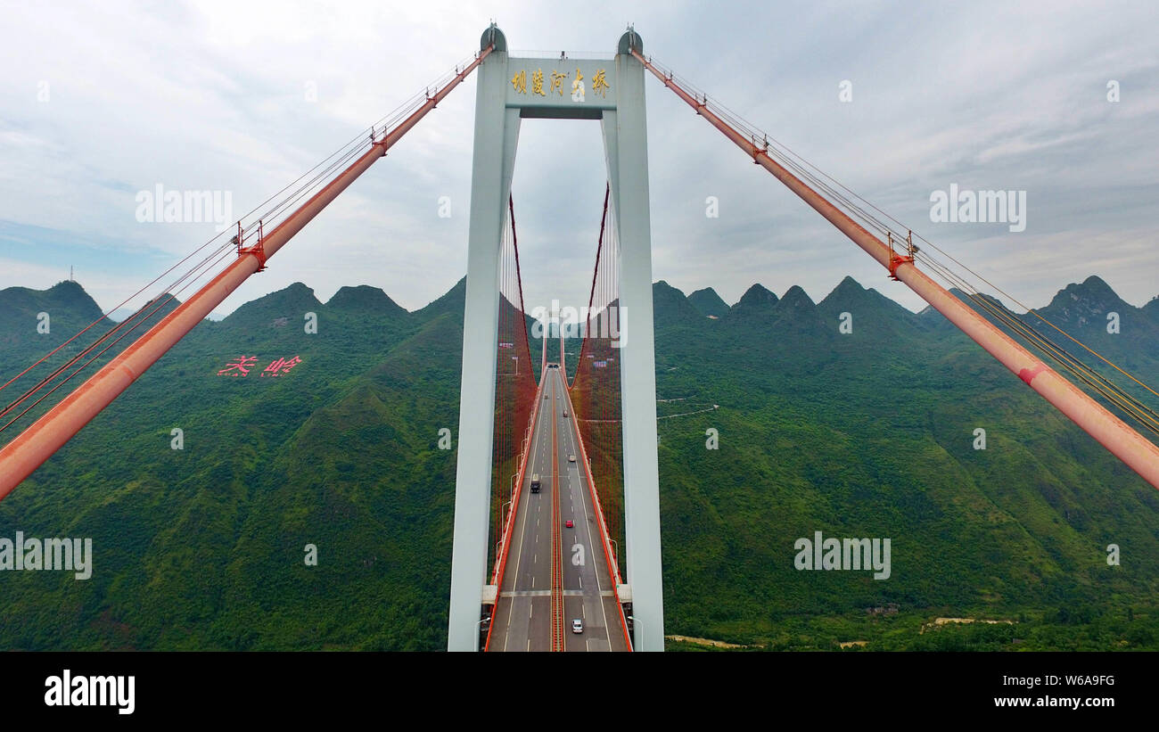 Aerial view of the Baling River Bridge 370 meters high over a valley in ...