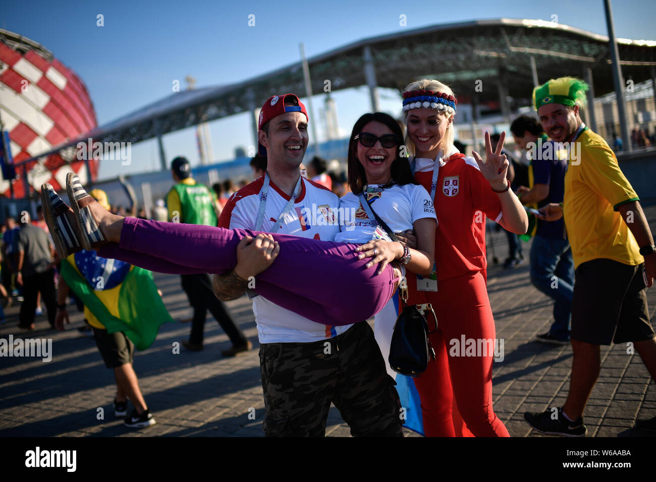 Serbian fans are dressed up as they gather outside the Spartak Stadium ...