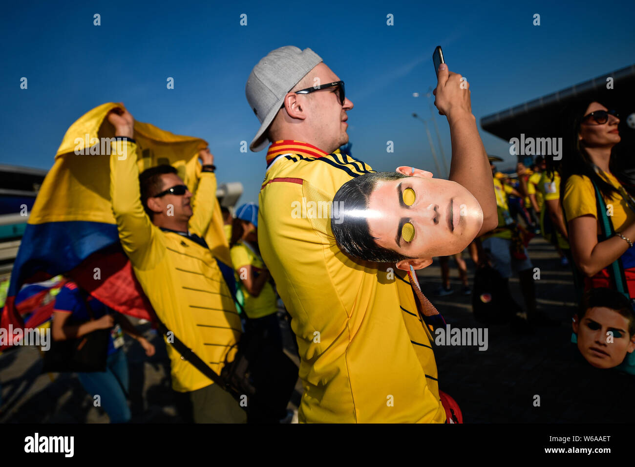 Colombian fans are dressed up as they gather outside the Kazan Arena ...