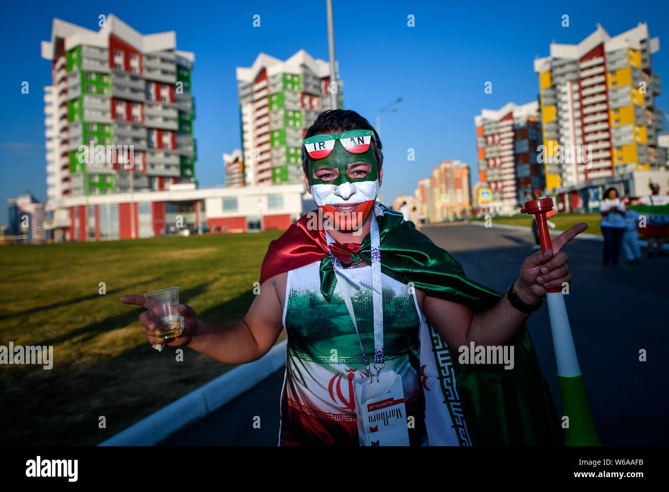 An Iranian fan is dressed up as he and others gather outside the ...