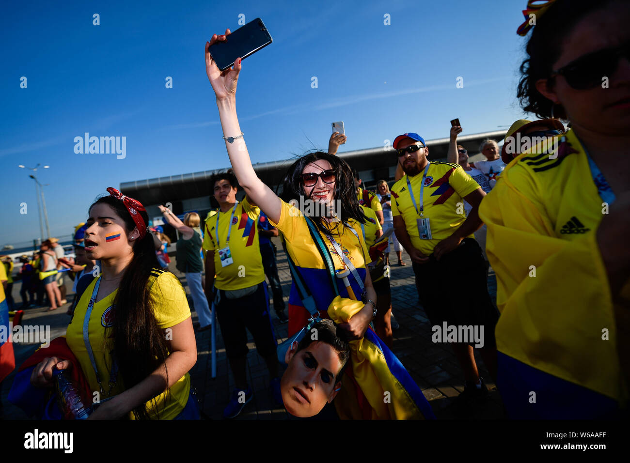 Colombian fans are dressed up as they gather outside the Kazan Arena ...
