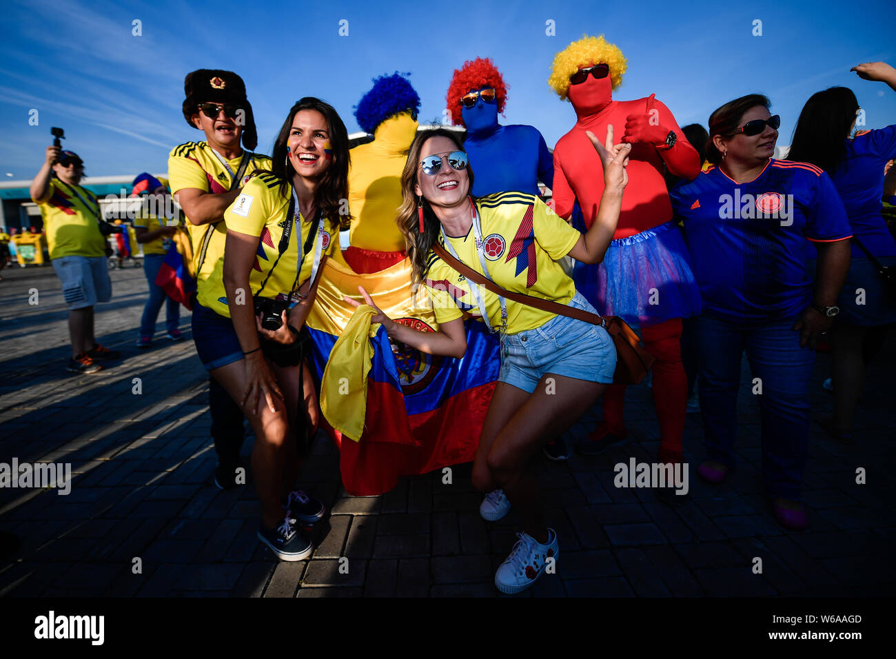 Colombian fans are dressed up as they gather outside the Kazan Arena ...