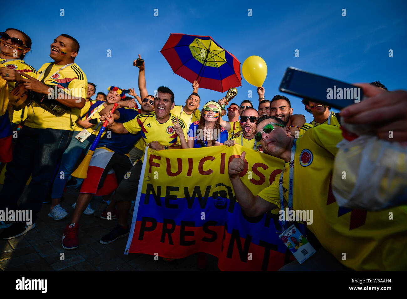 Colombian fans are dressed up as they gather outside the Kazan Arena ...