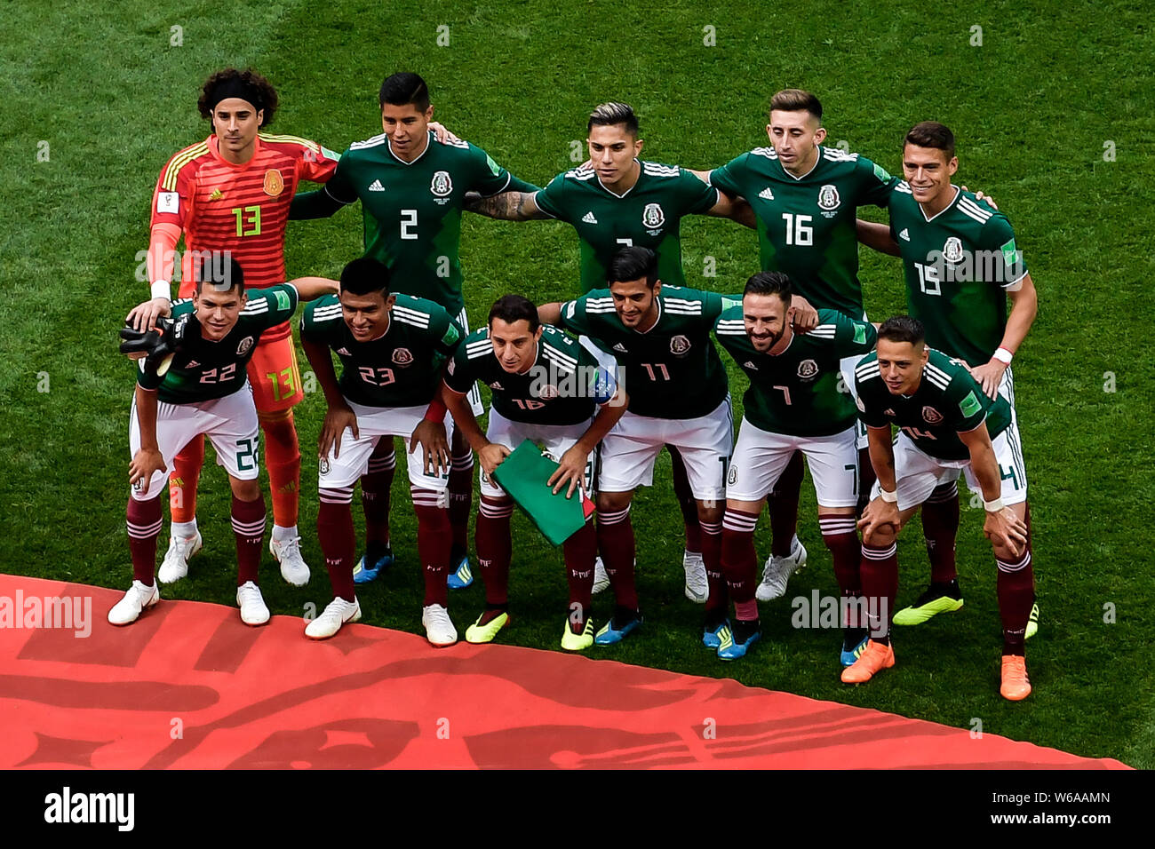 Members of the starting line-up of Mexico pose for photos before their ...