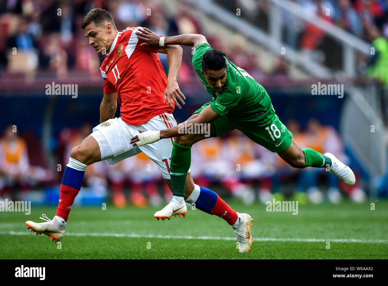 Roman Zobnin of Russia, left, challenges Salem Al-Dawsari of Saudi ...