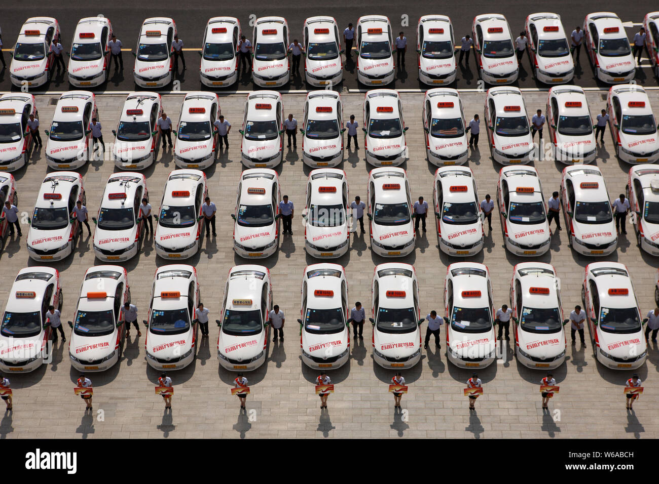 Aerial view of cars provided by a driving school to pick up students to ...
