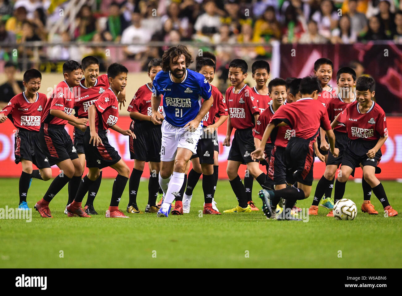 Italian retired football player Andrea Pirlo, center, of International ...