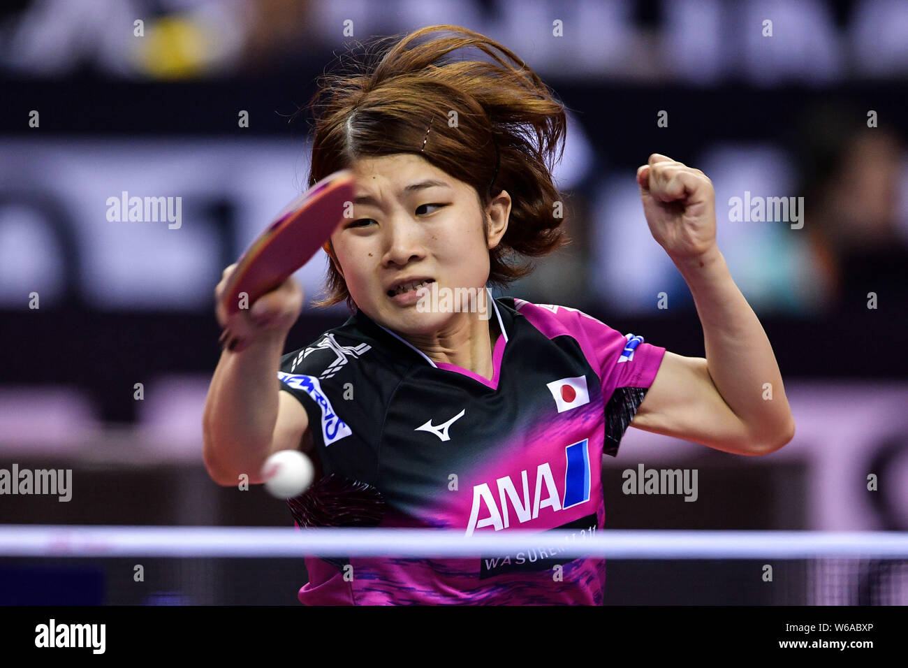 Ando Minami of Japan returns a shot to Zhu Yuling of China in their ...