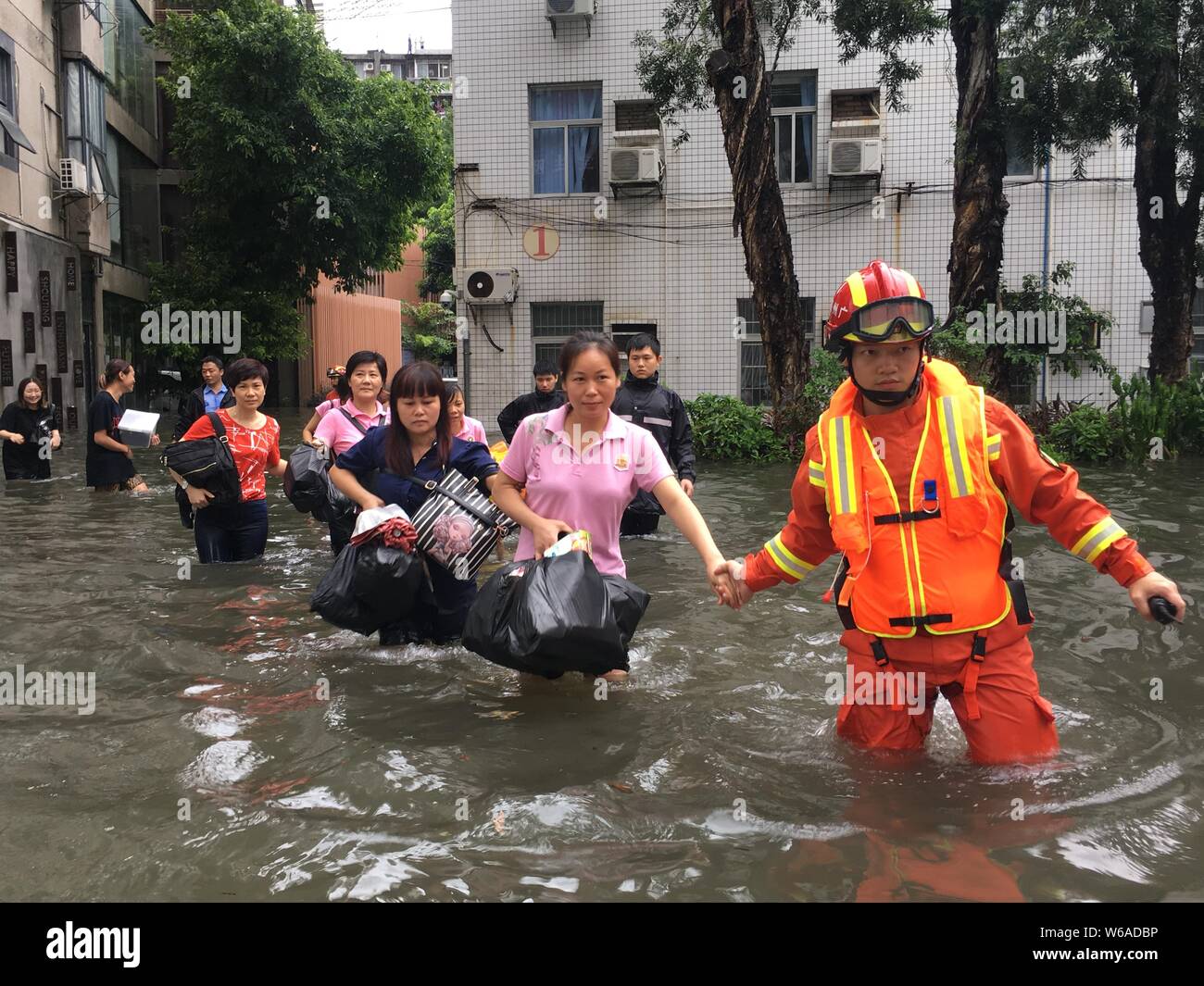 Chinese rescuers evacuate local residents from flooded areas caused by ...