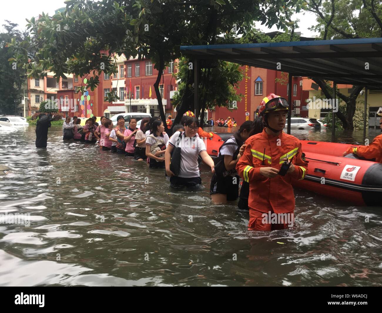 Chinese rescuers evacuate local residents from flooded areas caused by ...