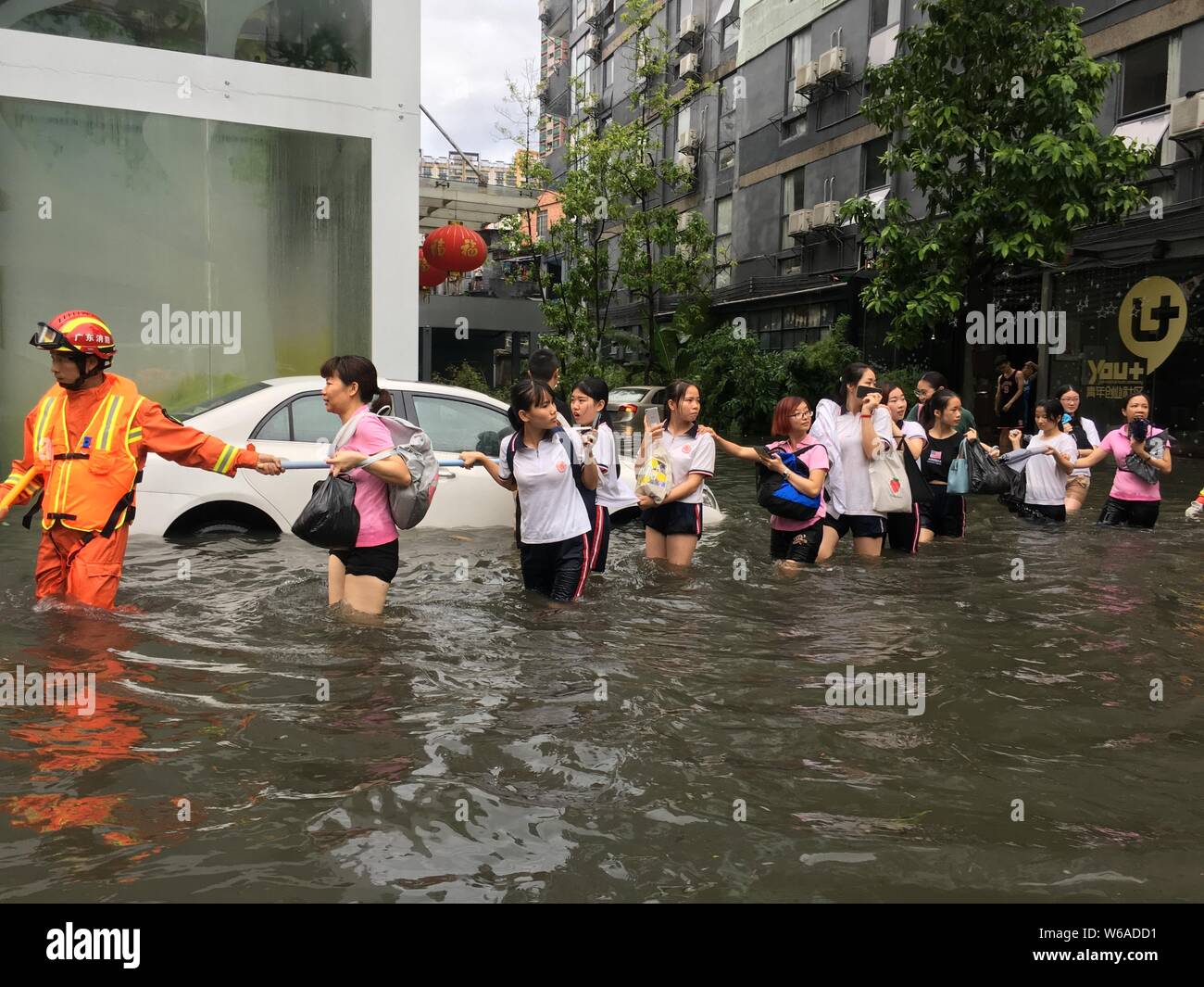 Chinese rescuers evacuate local residents from flooded areas caused by ...