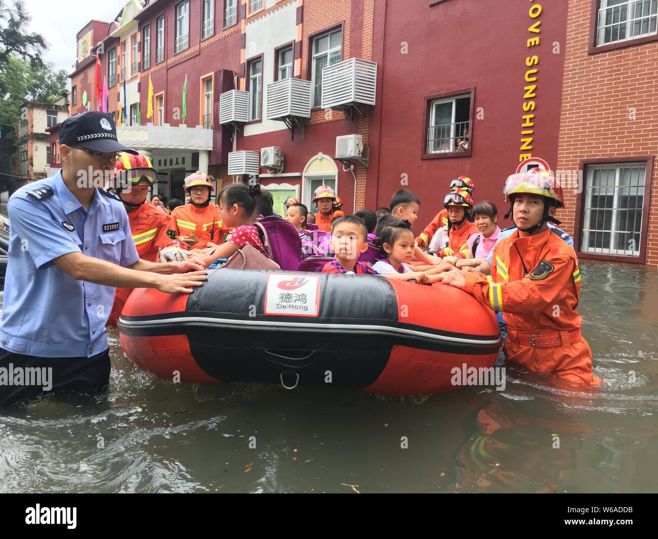 Chinese rescuers evacuate local residents from flooded areas caused by ...