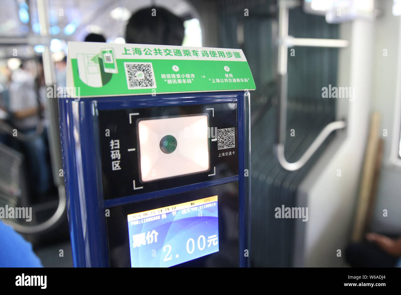 A POS machines installed on a bus for passengers to scan the QR codes ...