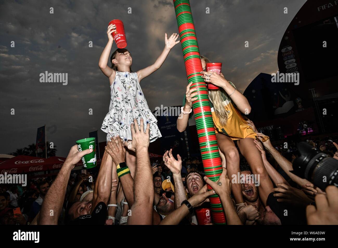 Football fans from the whole world build a human tower in order to ...