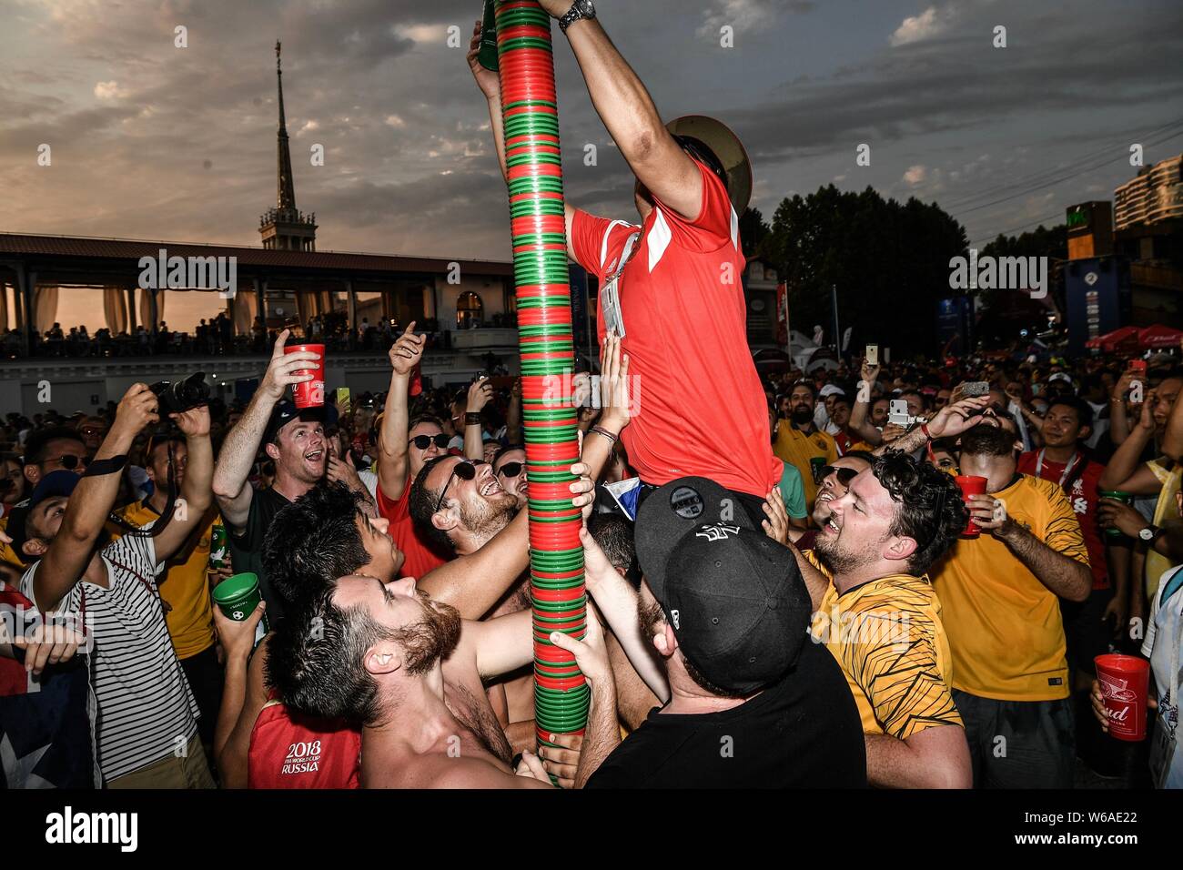 Football fans from the whole world build a human tower in order to ...
