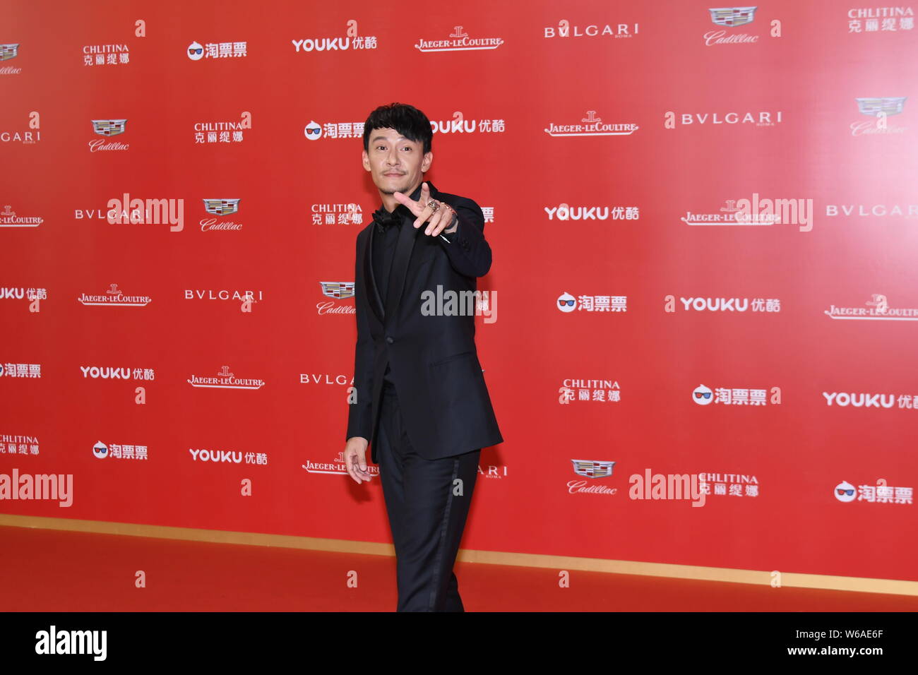 Taiwanese actor Zhang Zhen poses as he arrives on the red carpet for ...