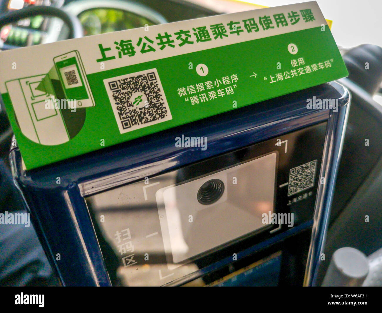 A POS machines installed on a bus for passengers to scan the riding QR ...