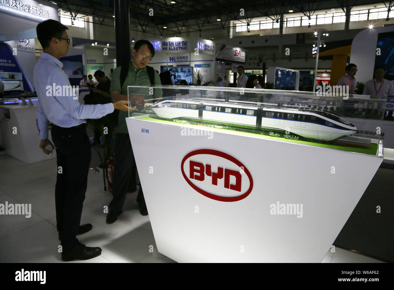--FILE--Visitors look at a monorail train model dubbed "SkyRail" at the ...