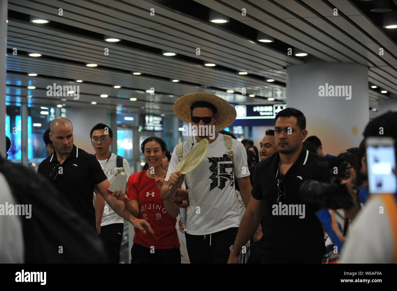 American basketball player Klay Thompson, with a straw hat on the head ...