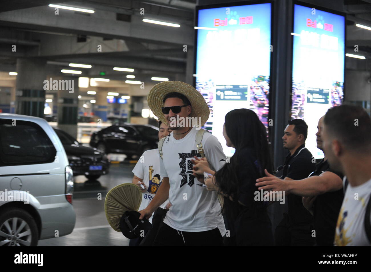 American basketball player Klay Thompson, with a straw hat on the head ...