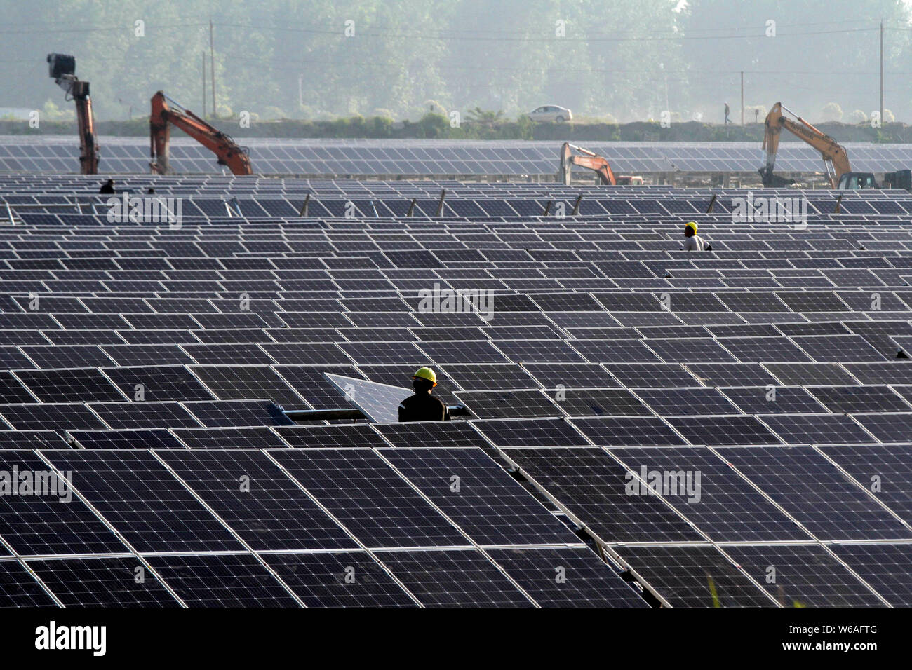 Install solar panel china hi-res stock photography and images - Alamy