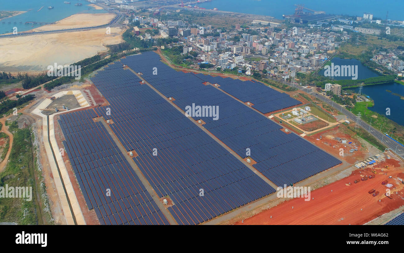 --FILE--An aerial view of arrays of solar panels at a photovoltaic ...