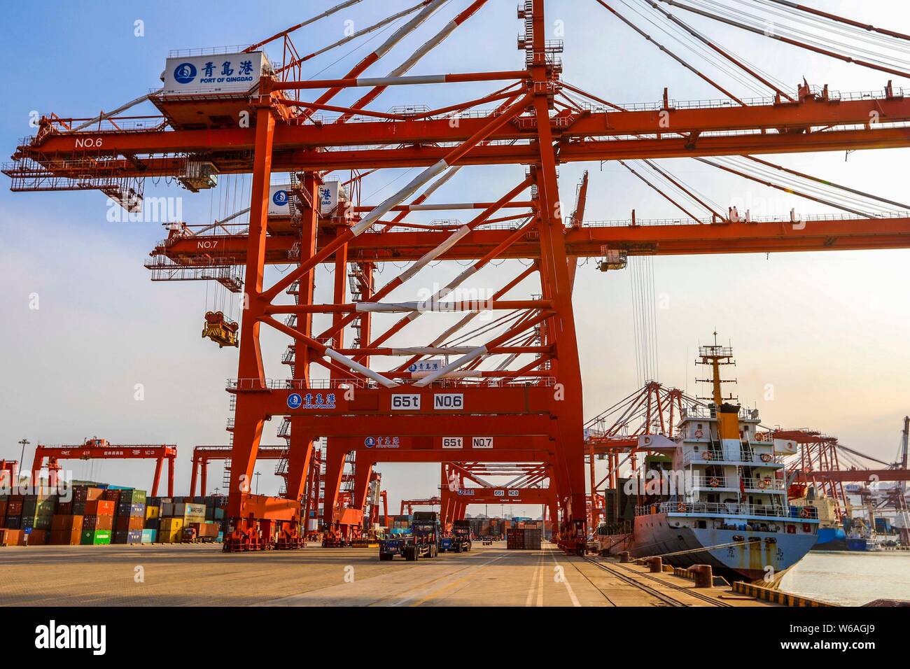 --FILE--A cargo ship loaded with containers to be shipped abroad berths ...