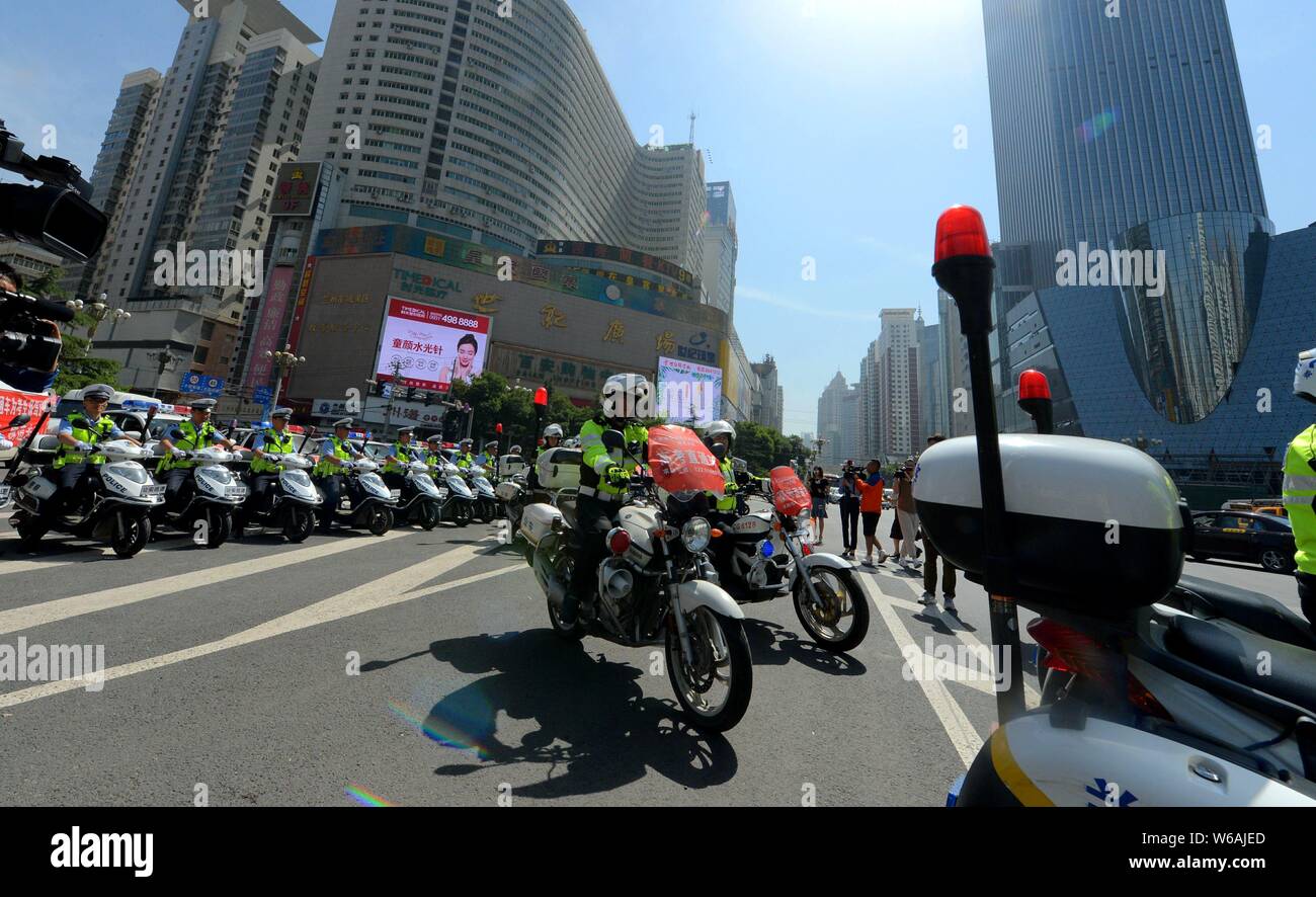 Chinese auxiliary traffic police officers pose with motorcycles during ...