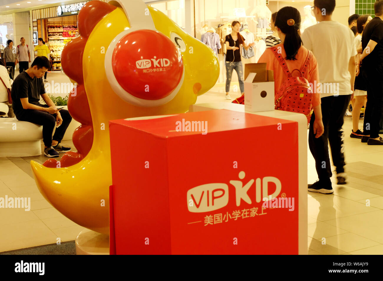--FILE--Customers walk past the stand of China's largest online ...