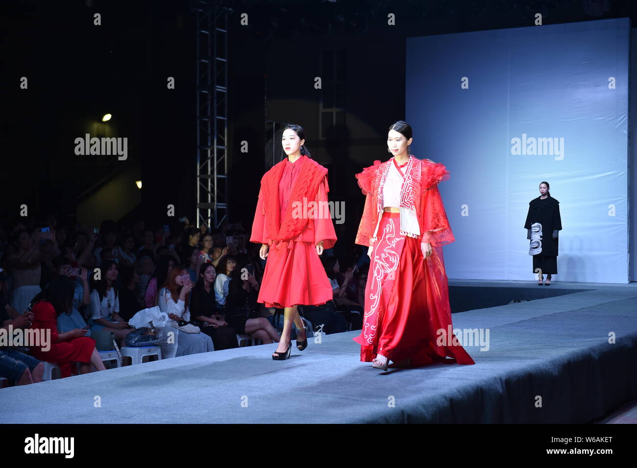 Models display new creations during a graduation show held by the ...