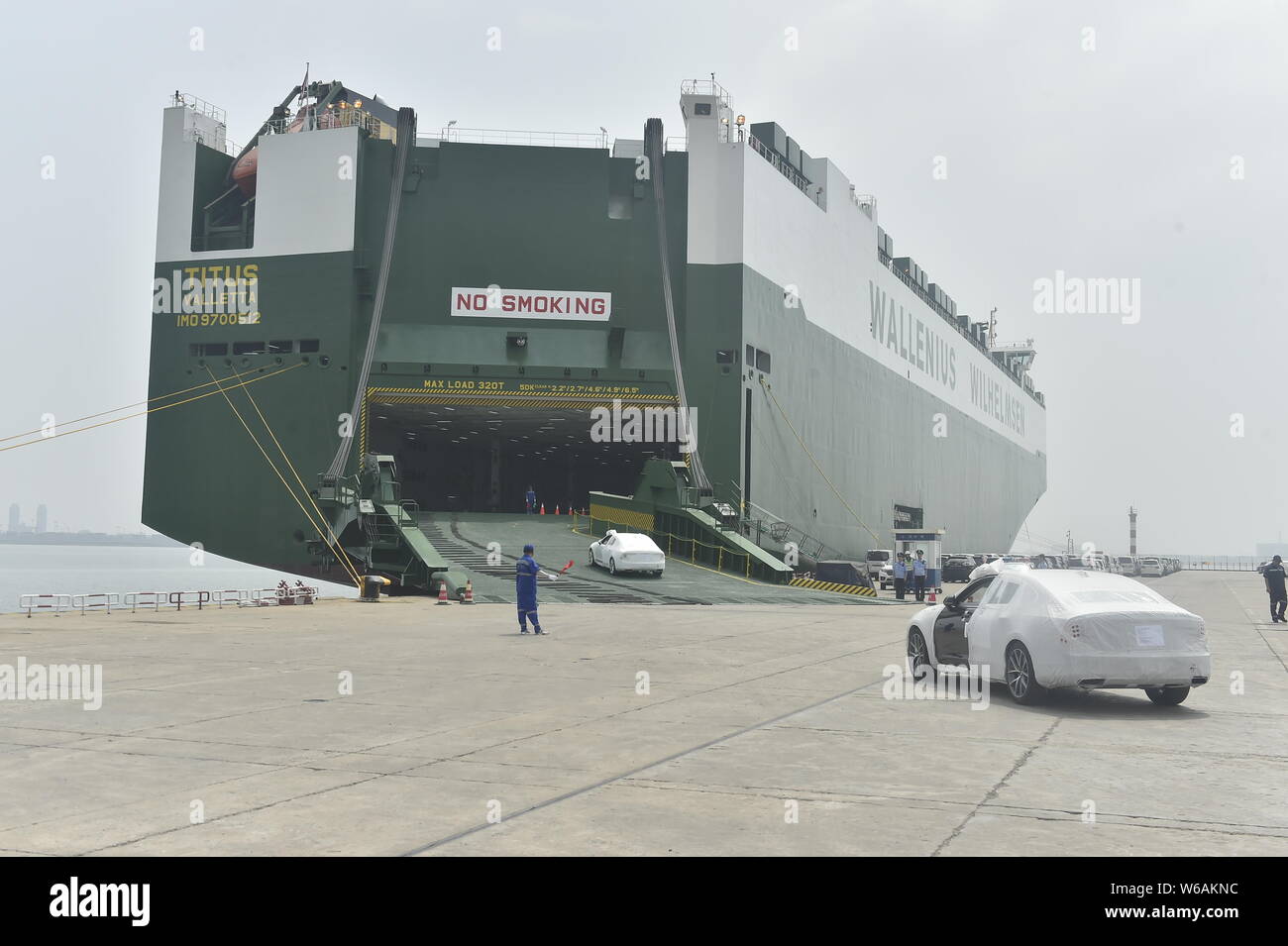 Cars to be shipped are been driven onto the TITUS Pure Car Truck ...