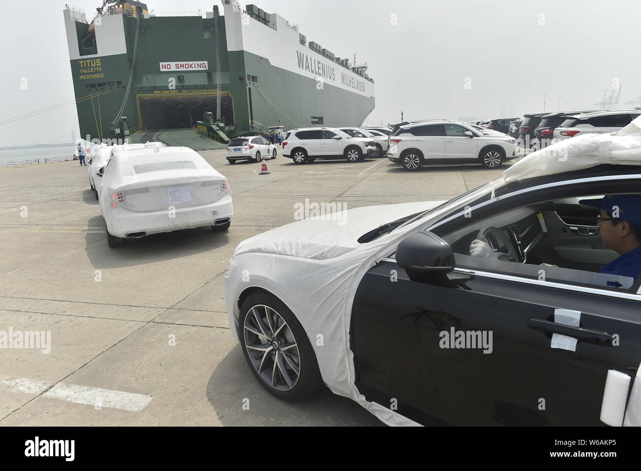 Cars to be shipped are been driven onto the TITUS Pure Car Truck ...