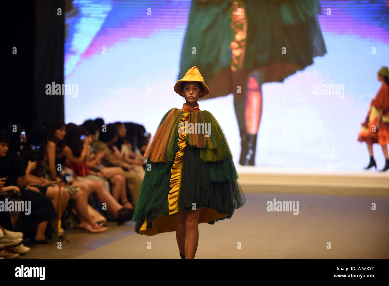 A model displays a new creation by a graduate during a fashion show for ...