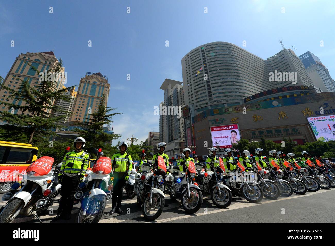 Chinese auxiliary traffic police officers pose with motorcycles during ...
