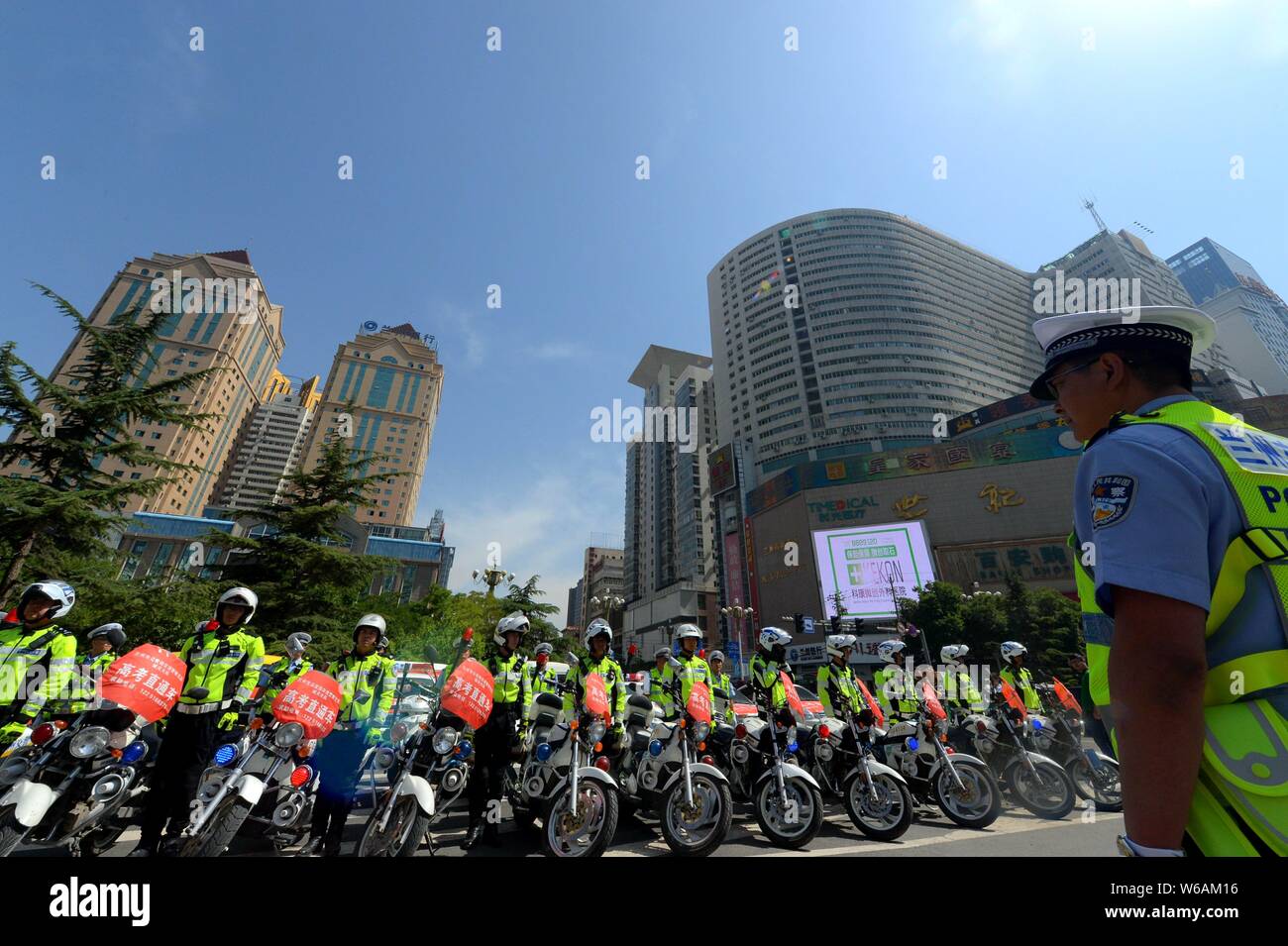 Chinese auxiliary traffic police officers pose with motorcycles during ...