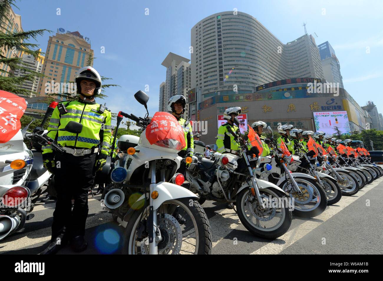 Chinese auxiliary traffic police officers pose with motorcycles during ...