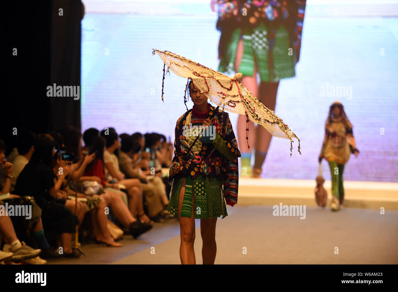 A model displays a new creation by a graduate during a fashion show for ...