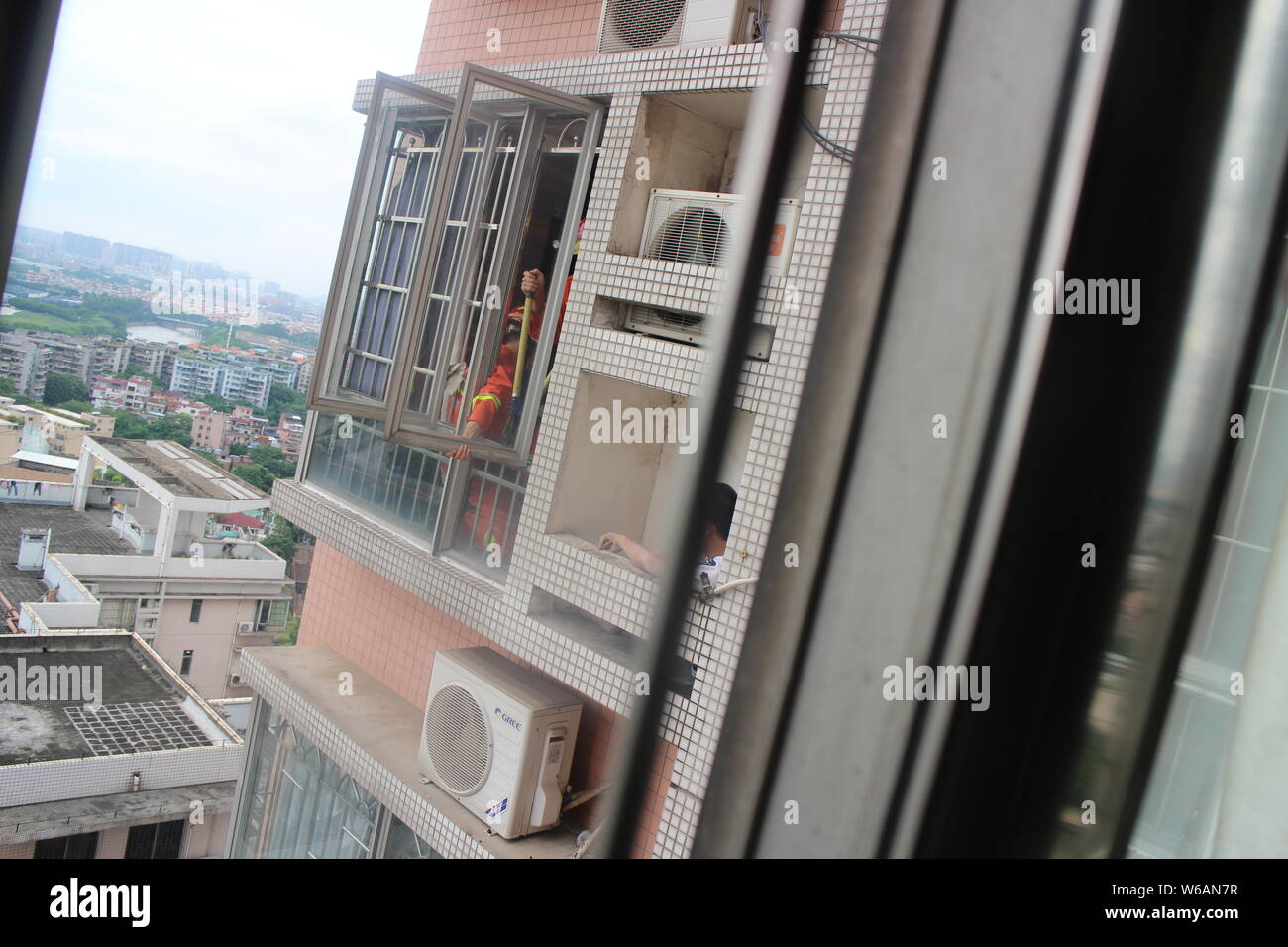 Chinese firefighters prepare to rescue a naughty boy after he got ...