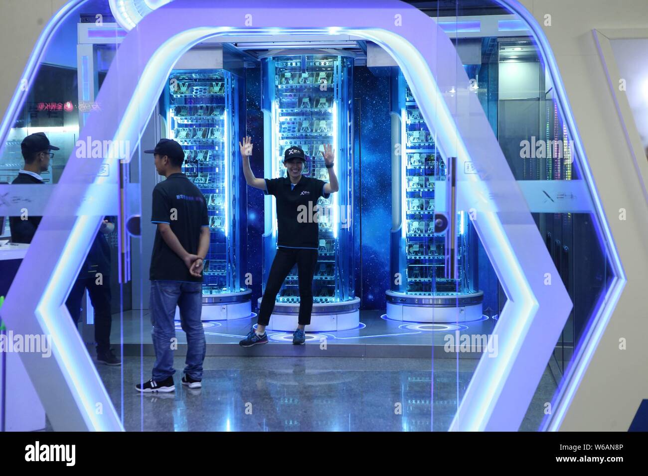 Customers shop at a 24-hour unmanned convenience store at the People's ...