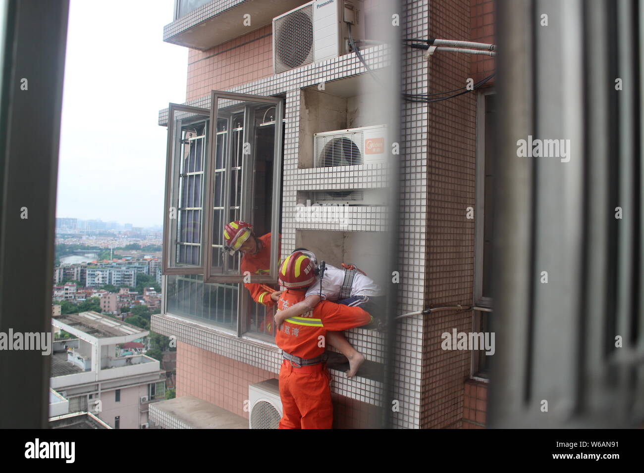 Chinese firefighters rescue a naughty boy after he got himself trapped ...