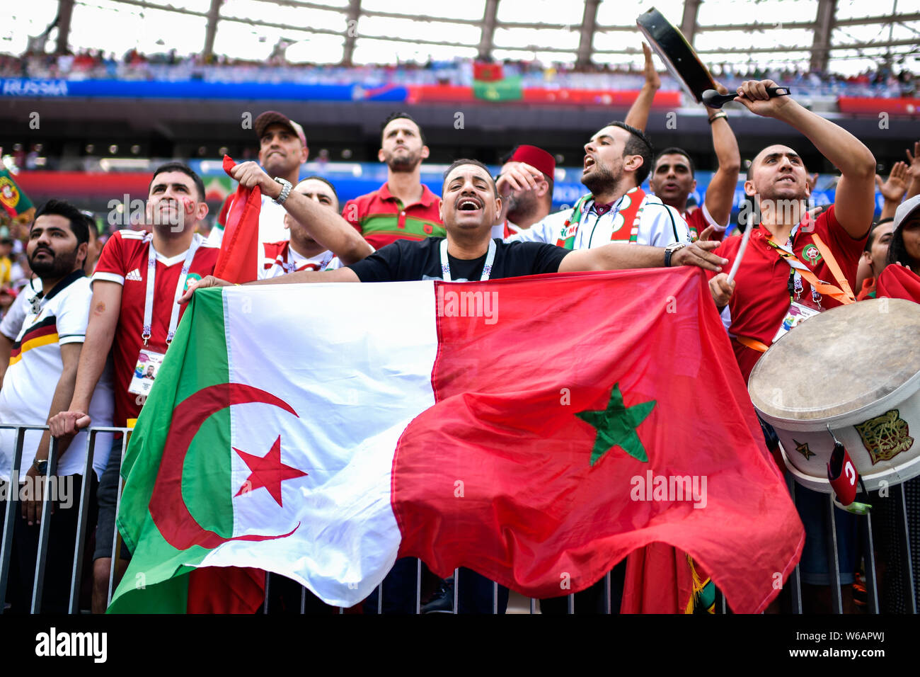 Fans wave flags and shout slogans to show their support for Morocco ...