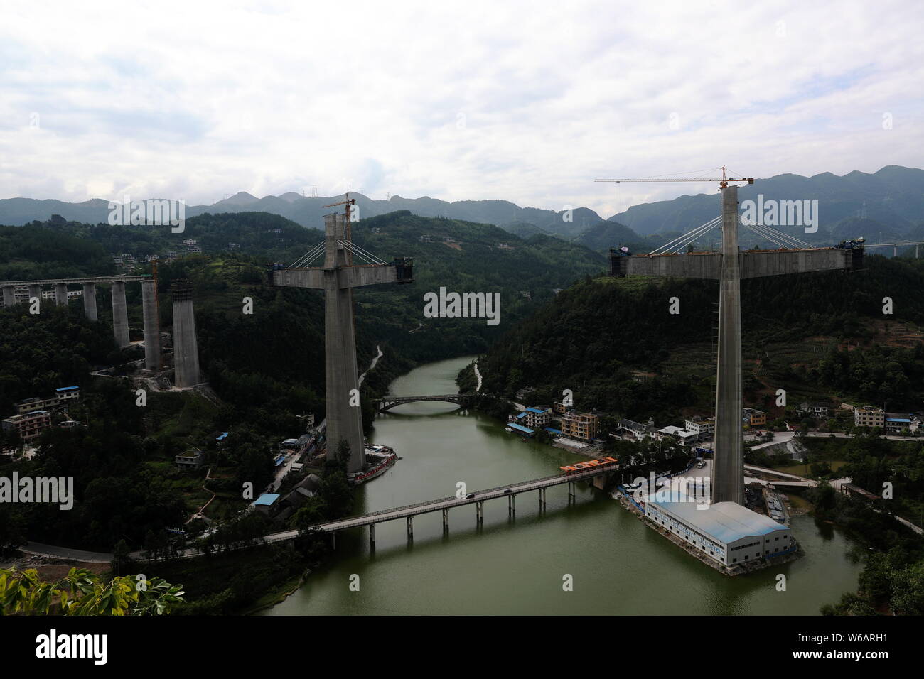 Chinese workers labor at the construction site of the stayed cable ...