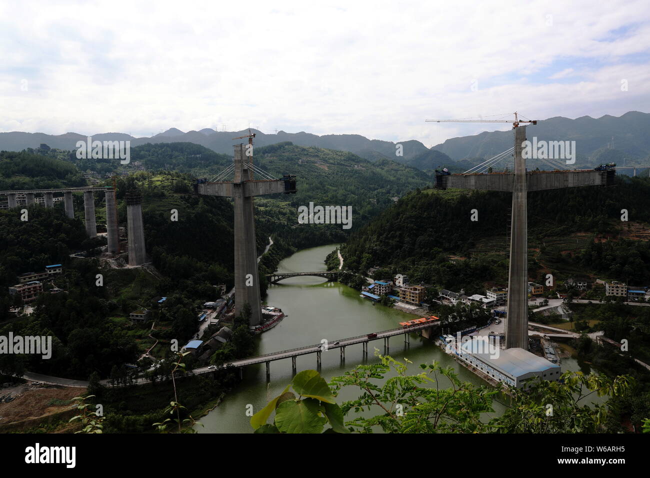 Chinese workers labor at the construction site of the stayed cable ...