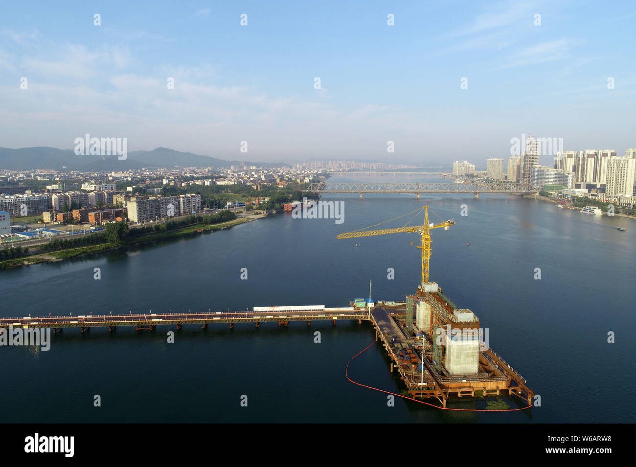 Aerial view of the construction site of the Panggong suspension bridge ...
