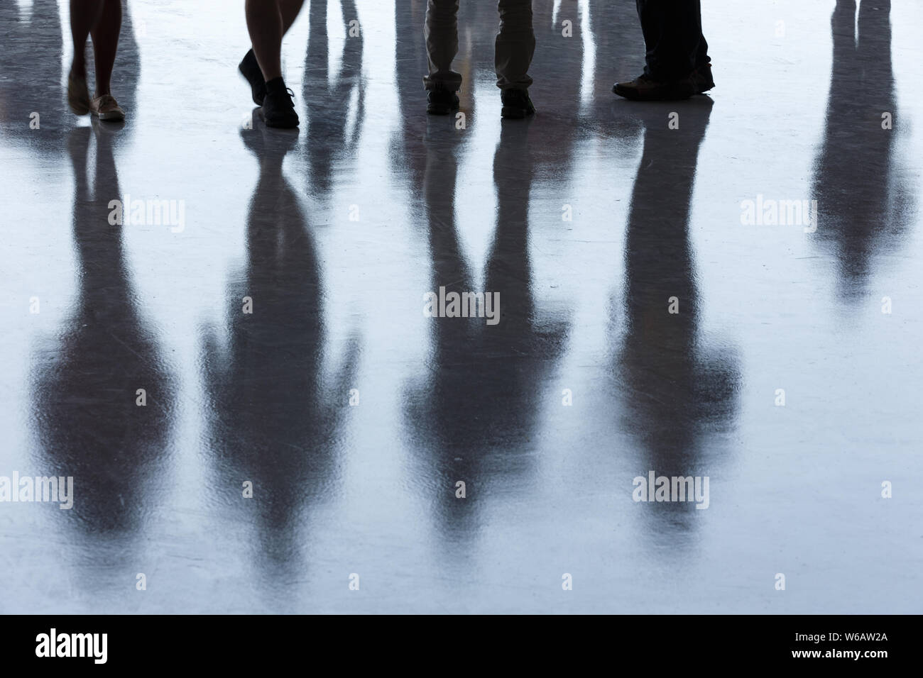 Black shadow of a group people on the ground Stock Photo - Alamy