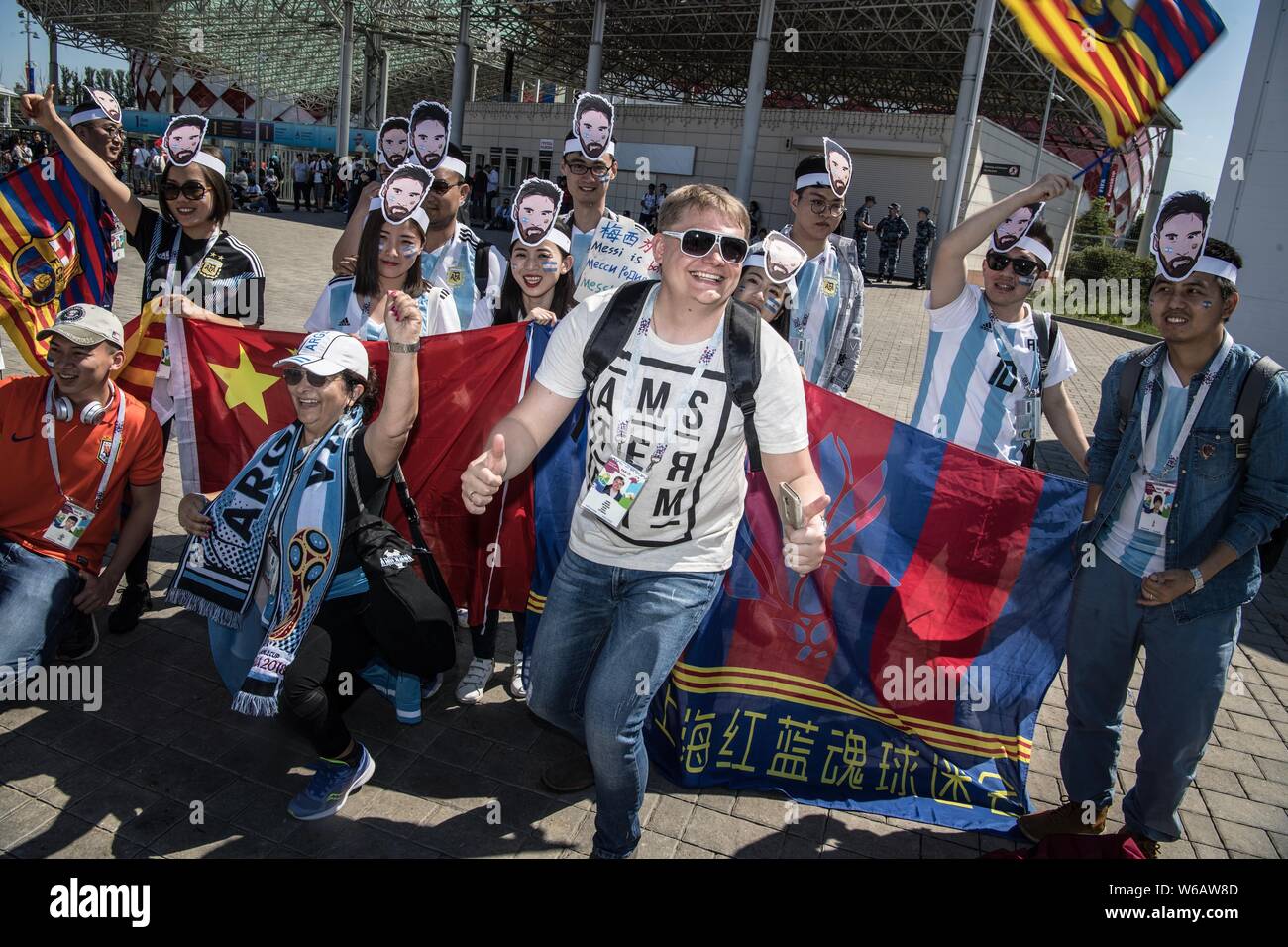 Chinese football fans of Lionel Messi, Argentina, holding flags of FC ...