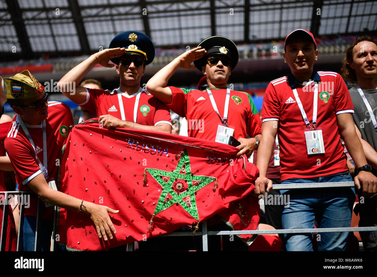 Fans wave flags and shout slogans to show their support for Morocco ...