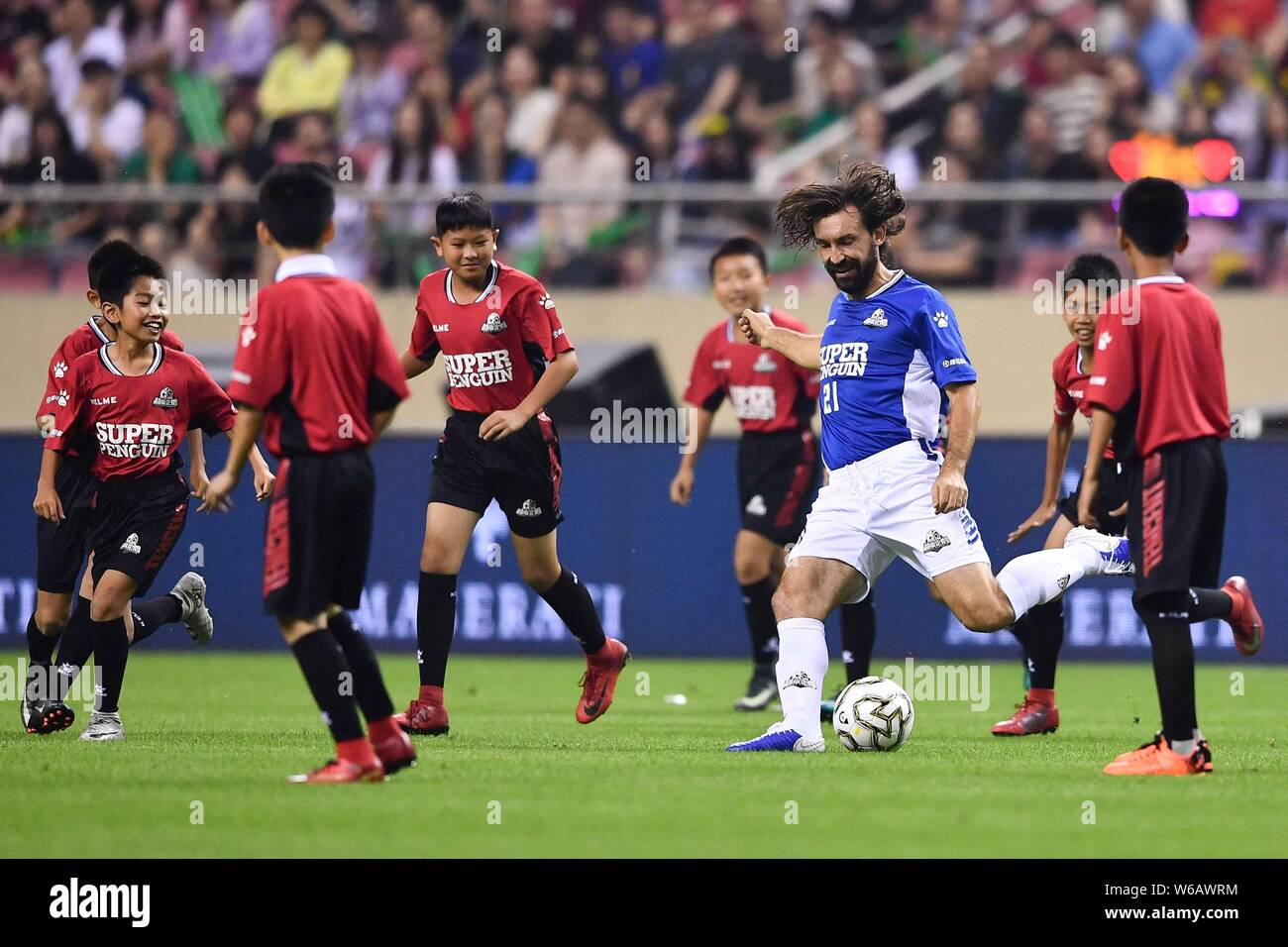 Italian retired football player Andrea Pirlo, center, of International ...